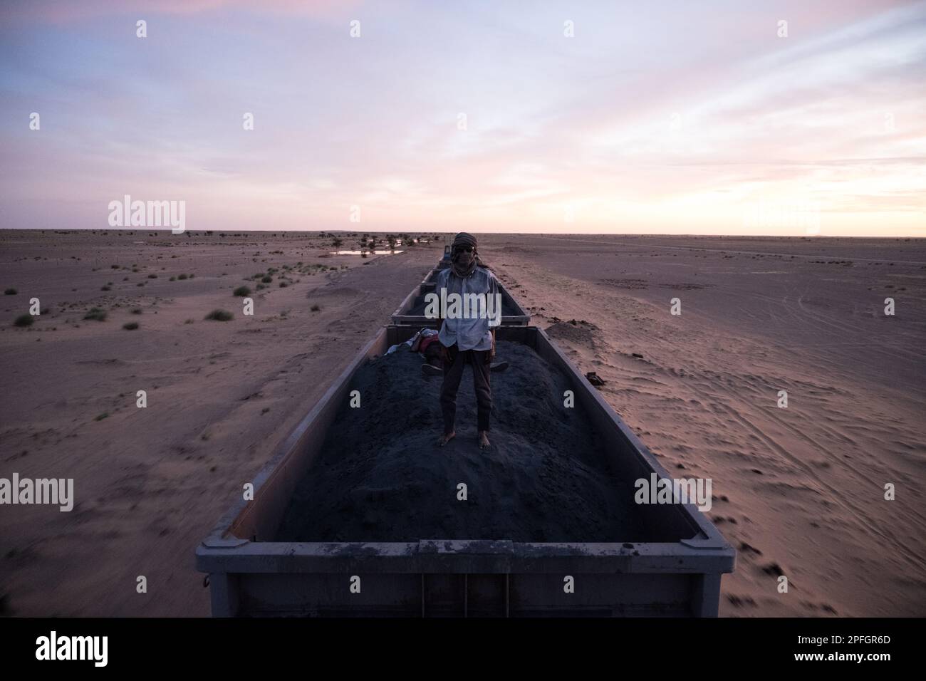 Adventure traveler on top of the Iron Ore Train from Zouerat to ...