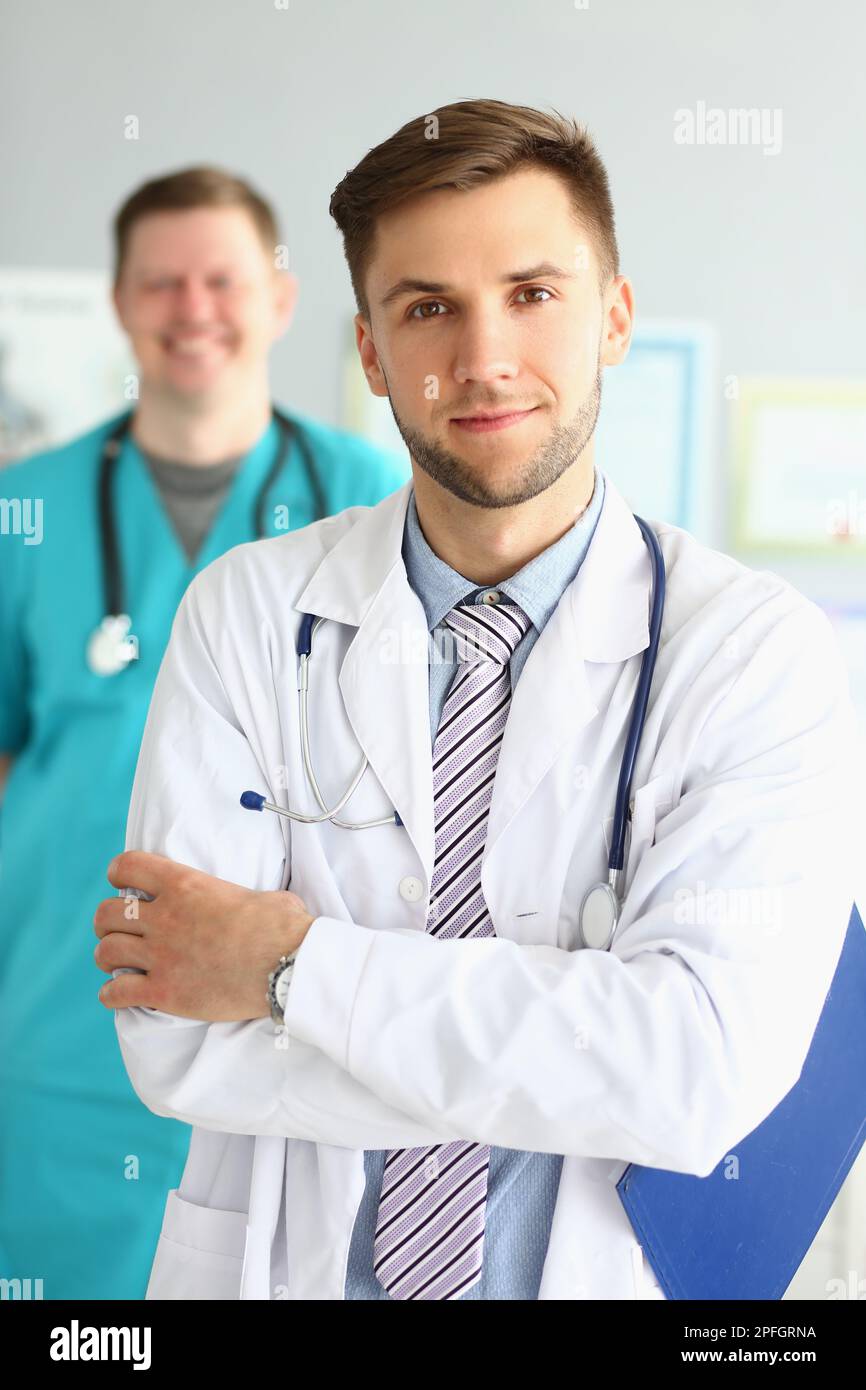 Medical team of doctors men looking at camera and smiling Stock Photo ...
