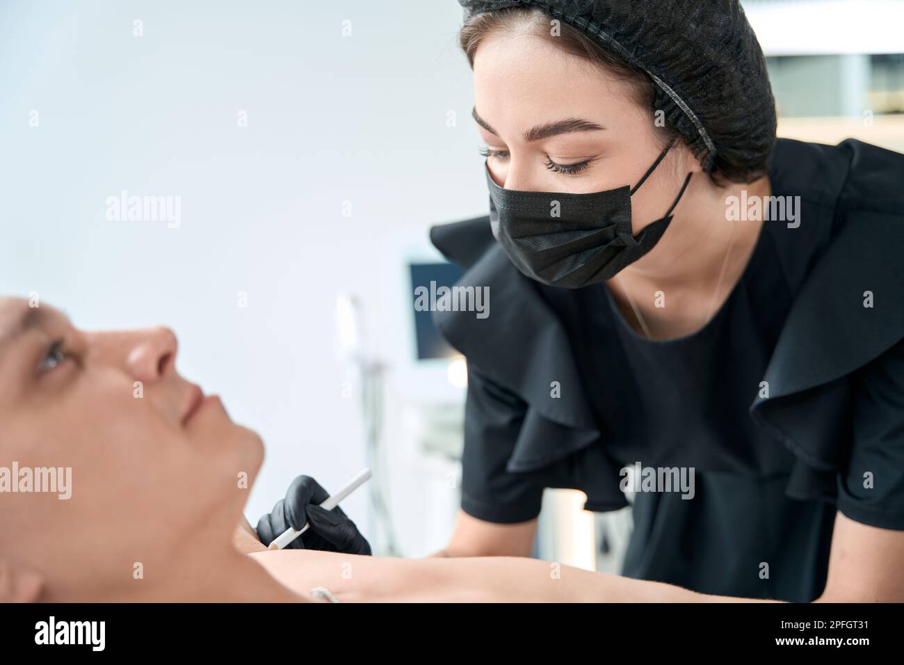 Man in clinic on armpit injections therapy procedure Stock Photo - Alamy