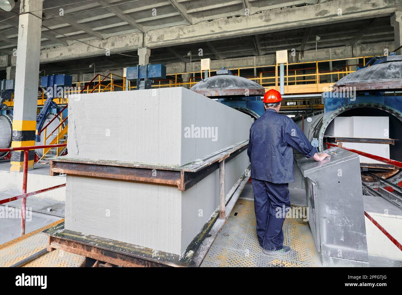Loading of raw blocks into autoclave at manufacturing plant Stock Photo ...