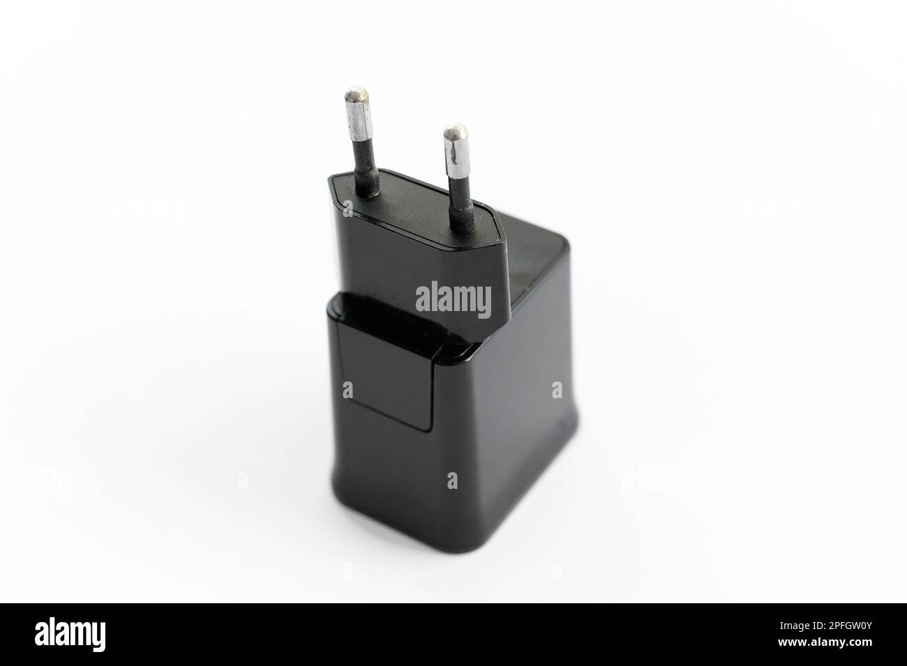 Mobile usb charger black color on white background on a horizontal ...