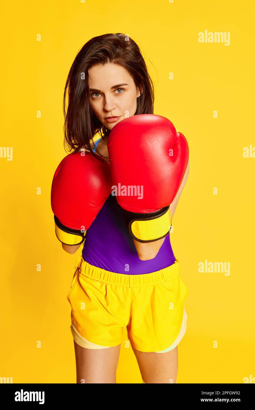 Fitness as hobby. Beautiful young brunette woman in stylish sportswear ...