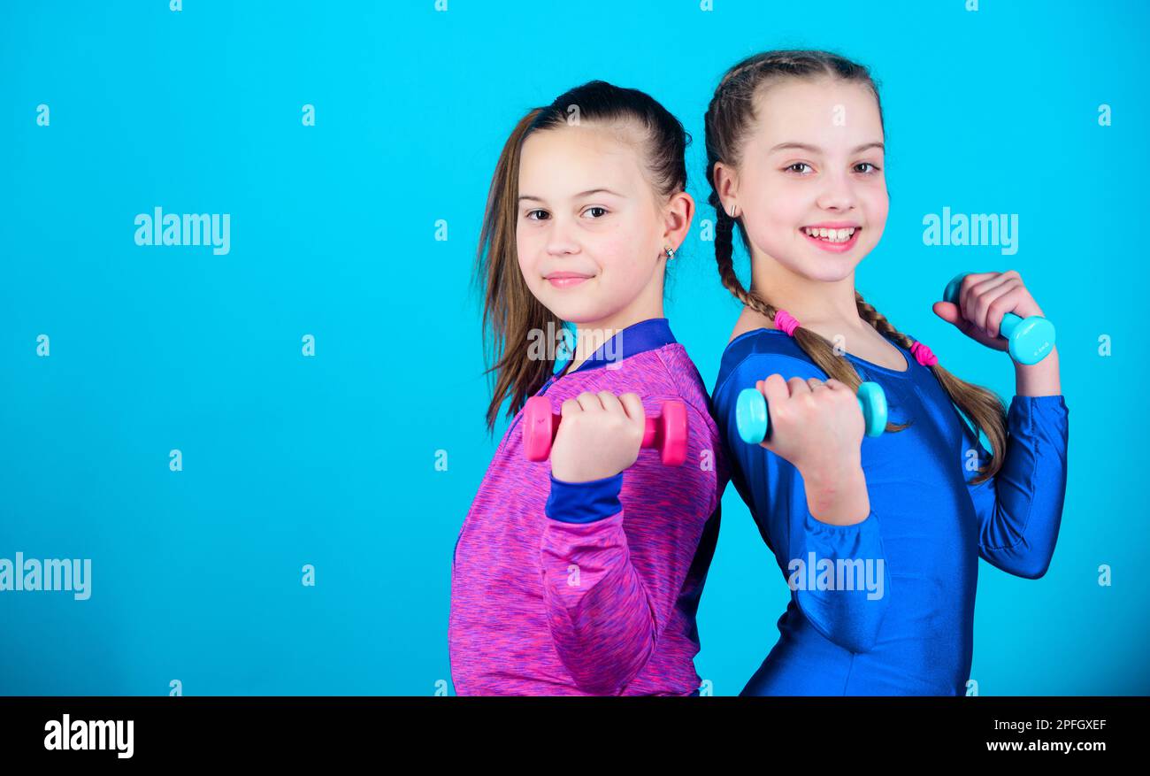 Easy exercises with dumbbell. On way to stronger body. Girls exercising ...