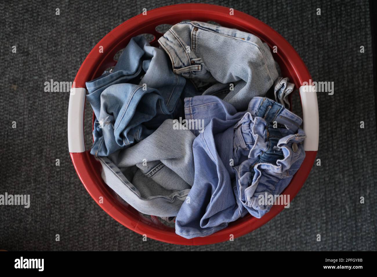 Dirty clothes in laundry basket hi-res stock photography and images - Alamy