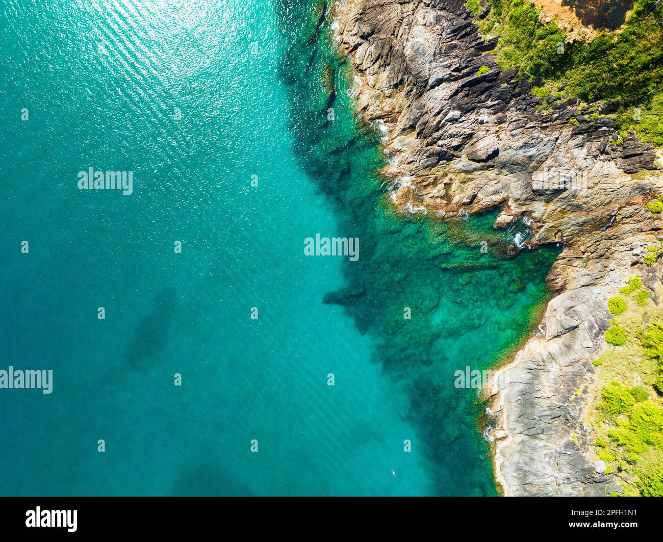 Aerial view of sea crashing waves White foaming waves on seashore rocks ...