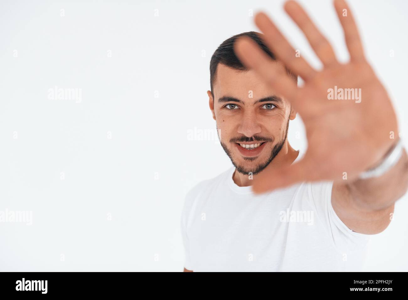 Stop Gesture Young Handsome Man Standing Indoors Against White