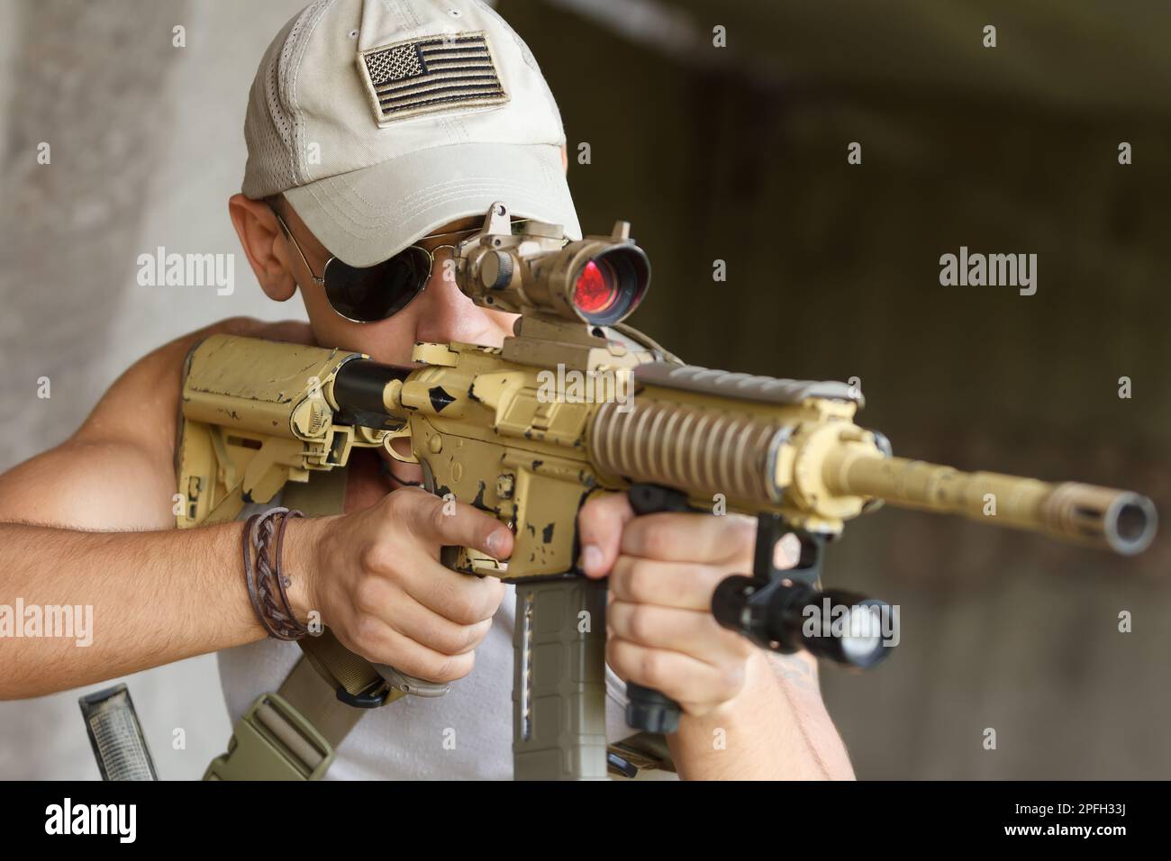 Ukrainian army soldier training with assault rifle outdoor. Cool young ...