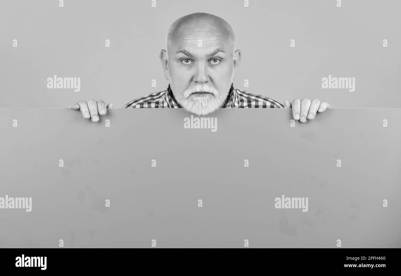 serious senior man with copy space on blank banner. advertising Stock ...
