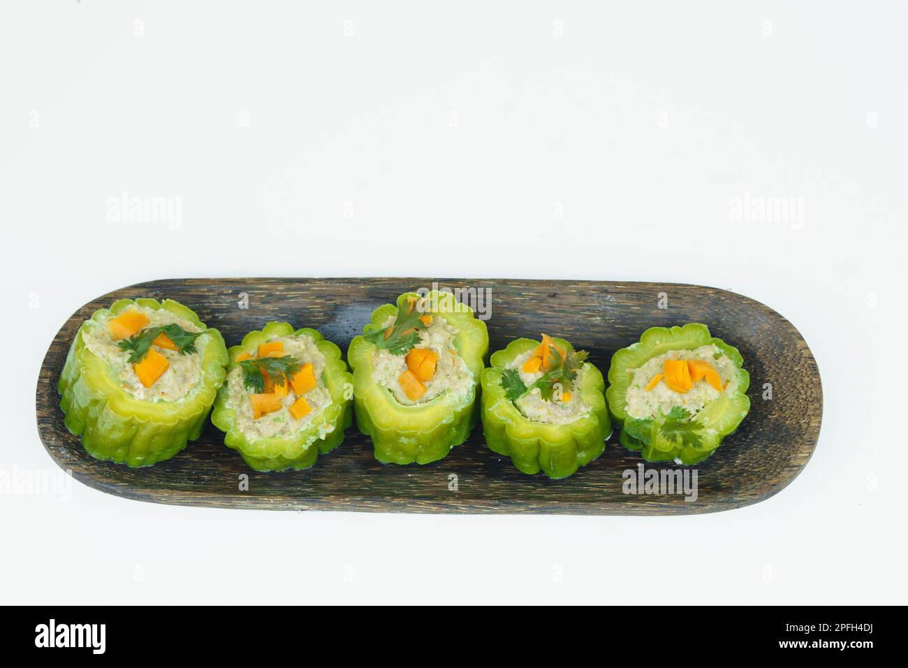 Pare or Bitter gourd stuffed with minced chicken meat served on the ...