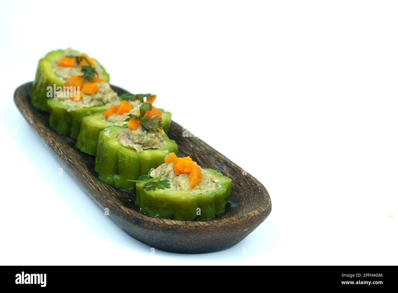 Pare or Bitter gourd stuffed with minced chicken meat served on the ...