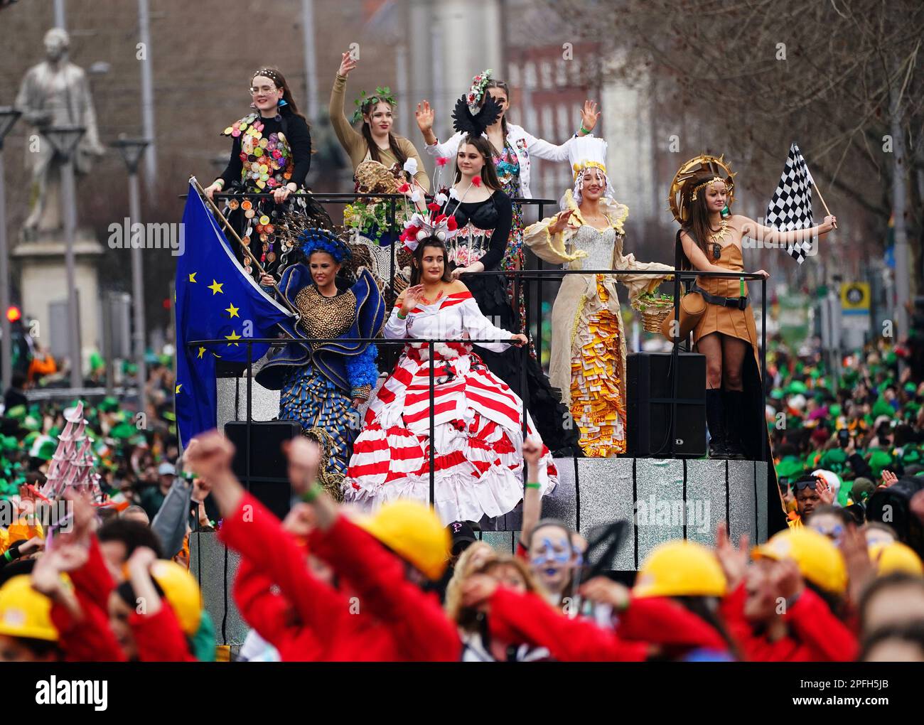 Performers make their way over O'Connell Bridge as they take part in ...