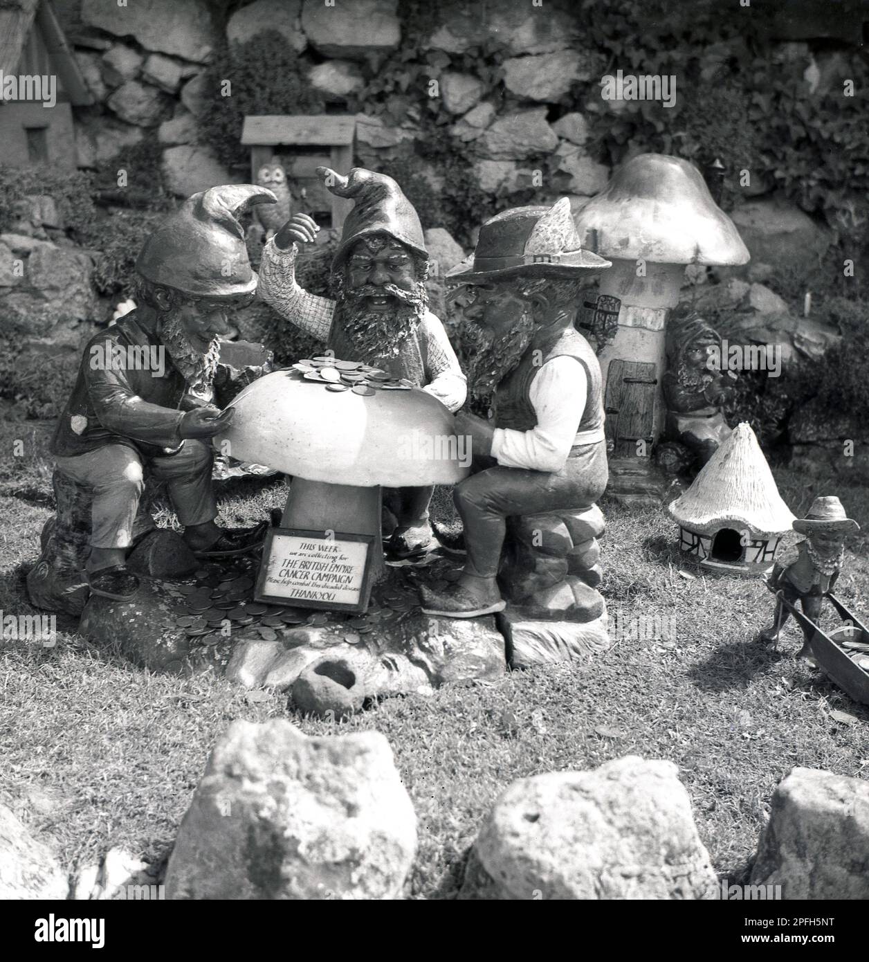 1955, historical, three gnomes sat at a toadstool at the model village ...