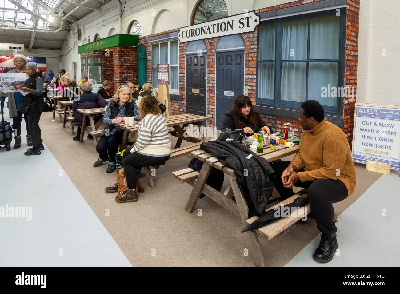 London, UK. 17 March 2023. Visitors take a break at a mock-up of ...