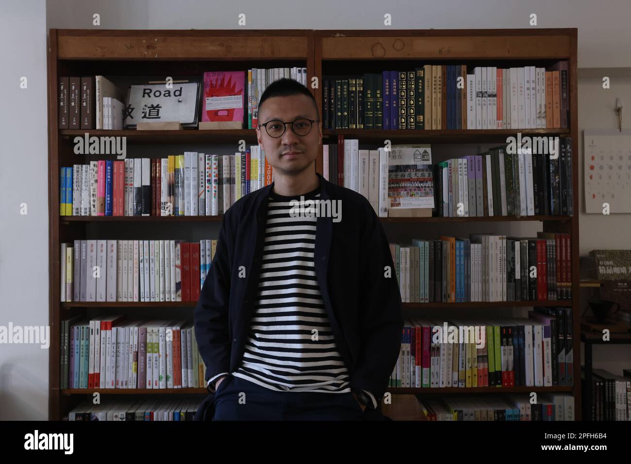 Word by Word bookshop owner Michael Lui Ka-Chun poses for a photo at ...