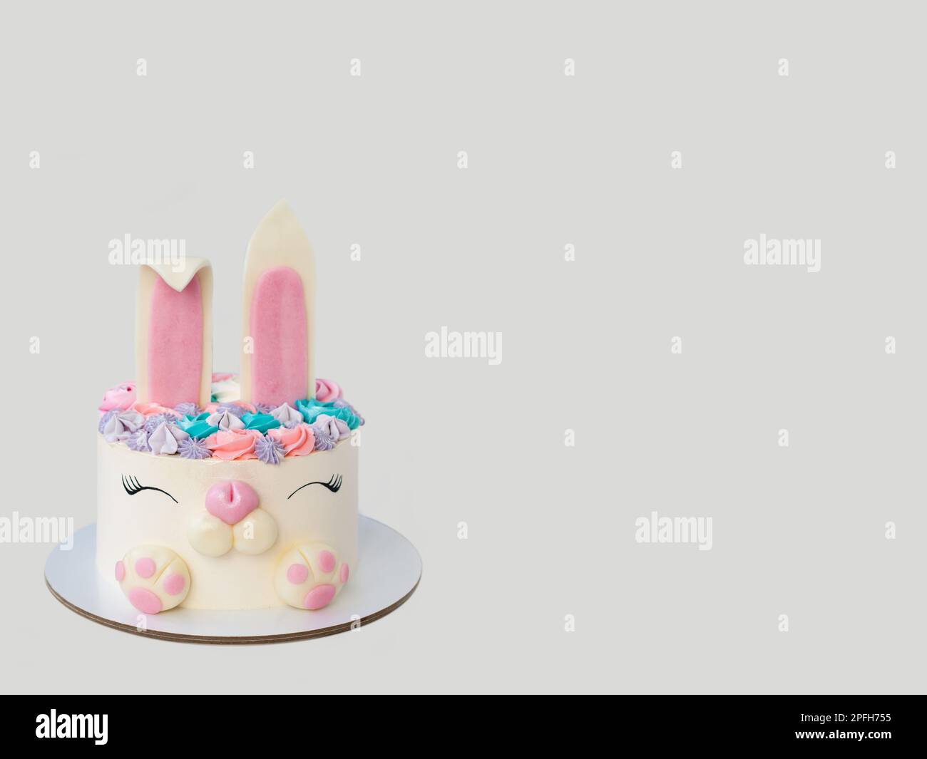 White and pink cake with cute bunny for children's birthday or Easter ...