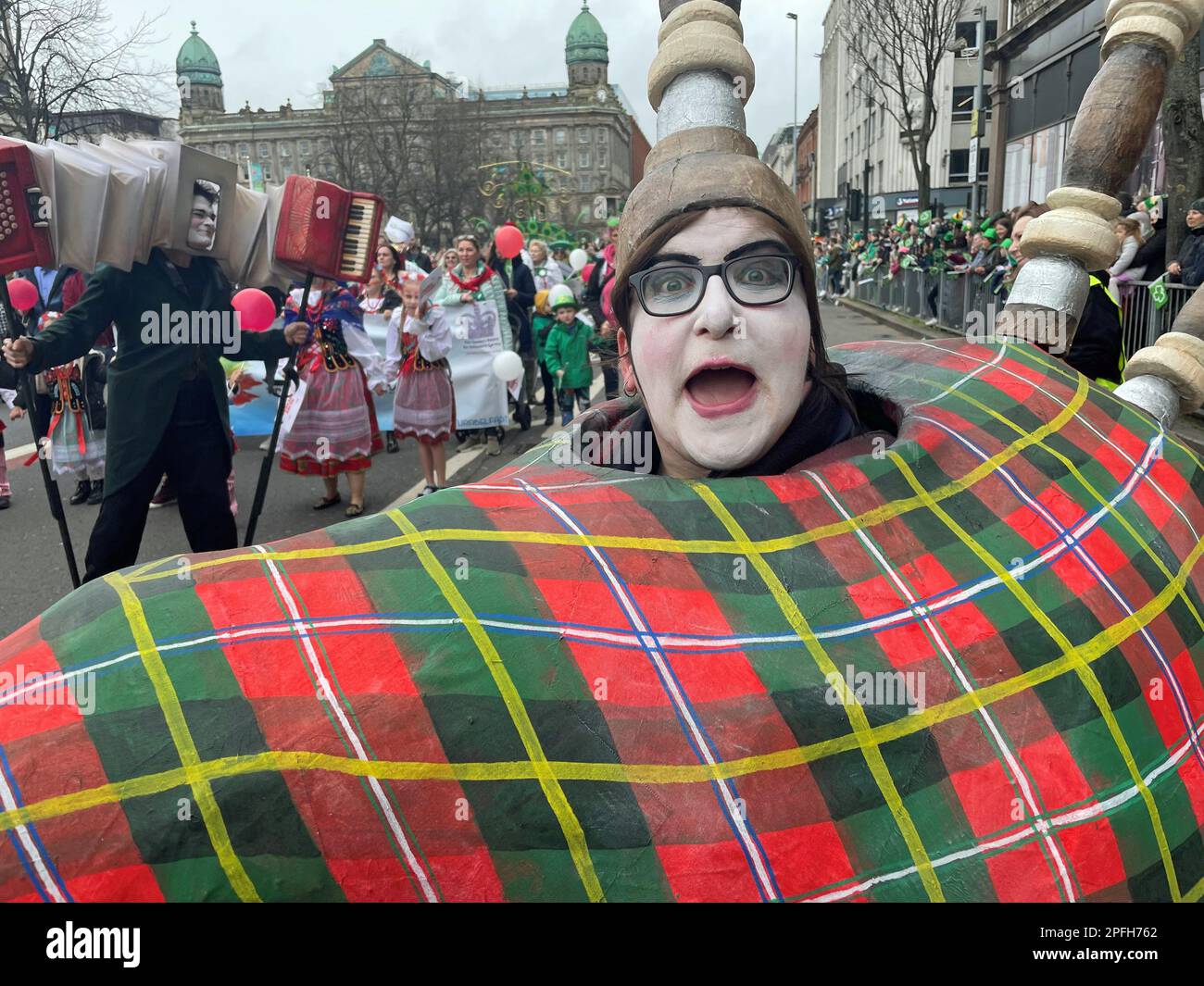 A performer takes part in the St Patrick's Day Parade in Belfast ...