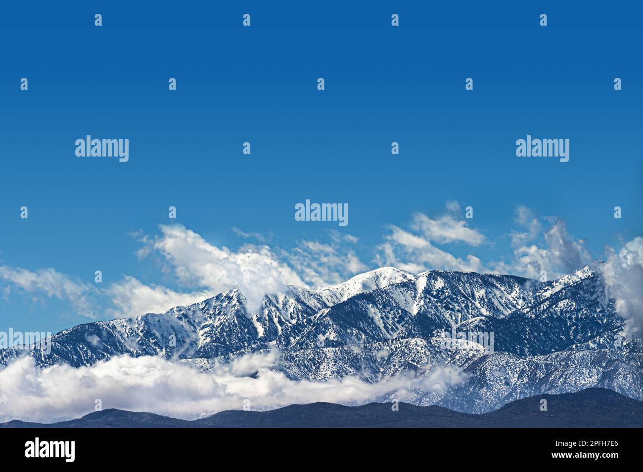 Clouds at snow capped mountain range in Southern California Stock Photo ... Clouds at snow capped mountain range in Southern California Stock Photo ...
