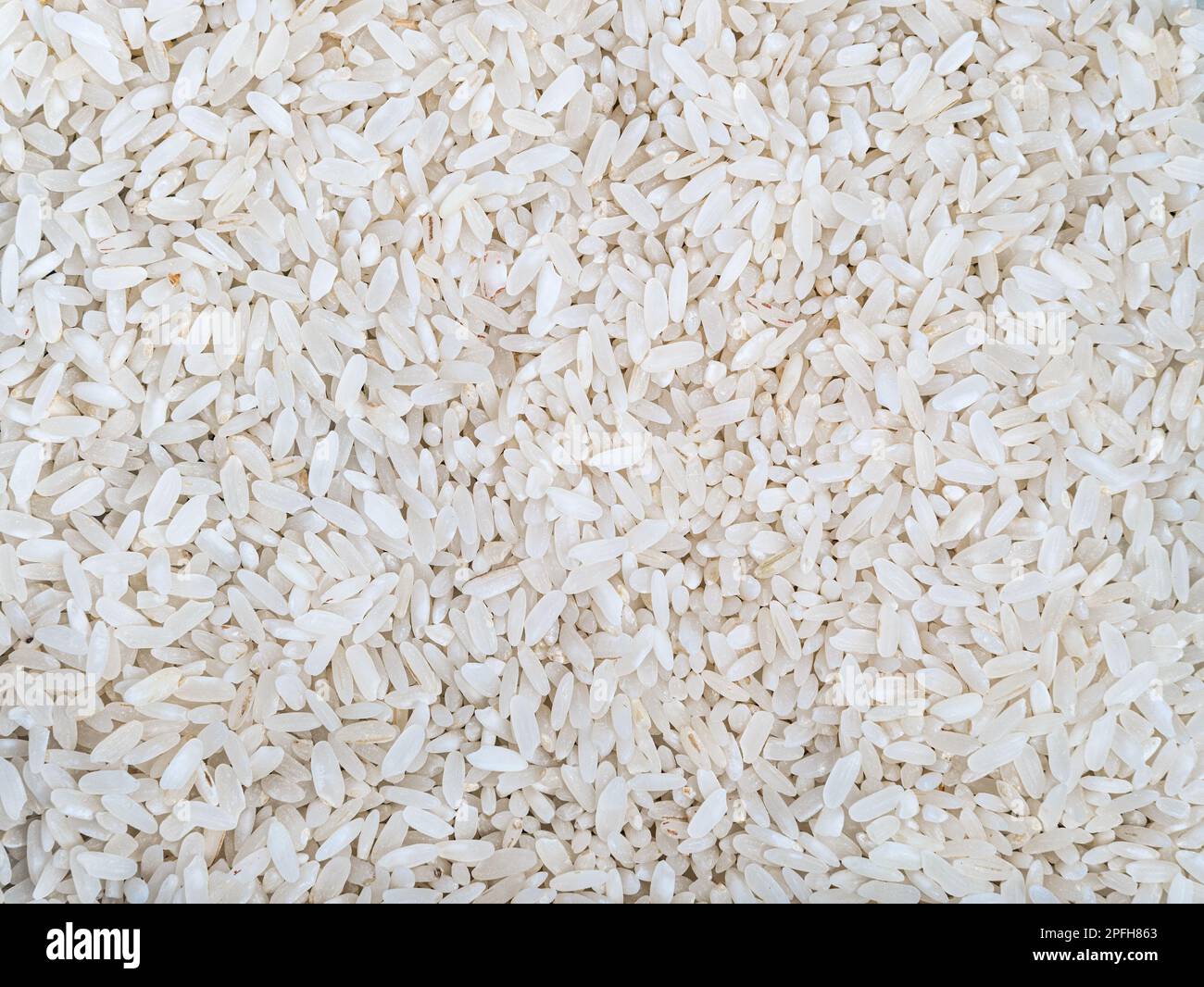 Organic white rice texture background Stock Photo - Alamy