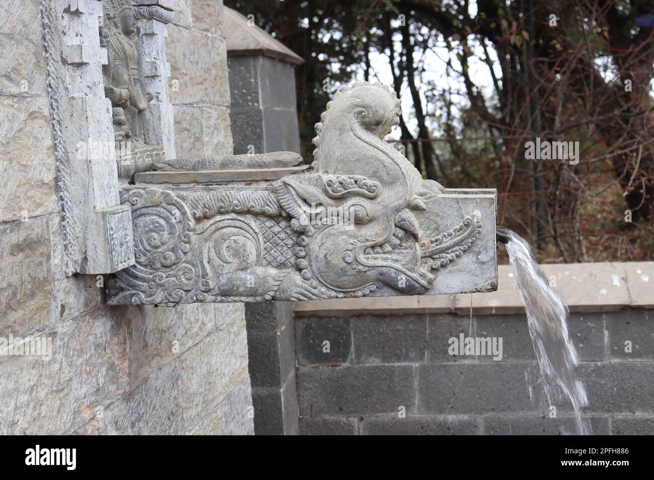 Antique style water tap made up of natural stone with beautiful ...