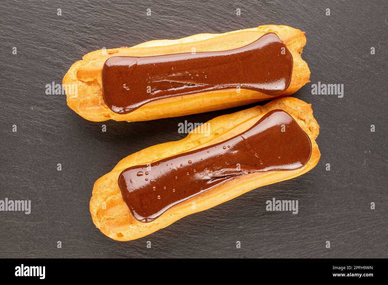 Board sweet chocolate eclairs hi-res stock photography and images - Alamy