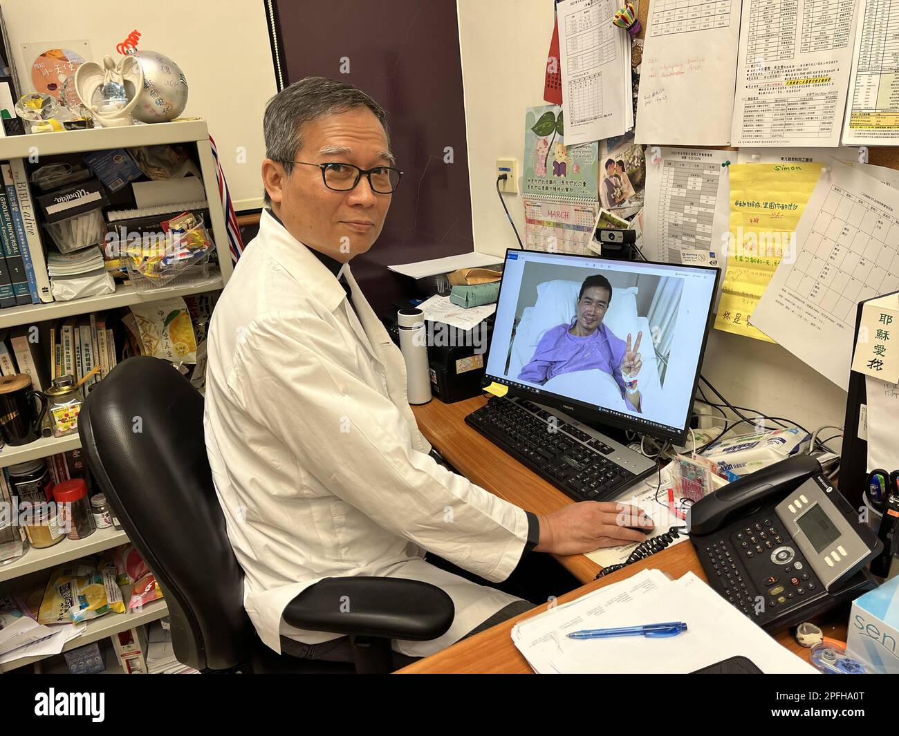 Reverend Simon Tse Yiu-yeung, a Sars survivor, was looking at the photo ...