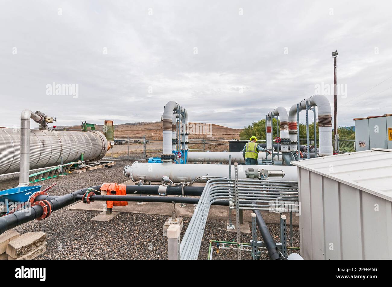 A fenced area containing tanks and piping for methane gas which is ...