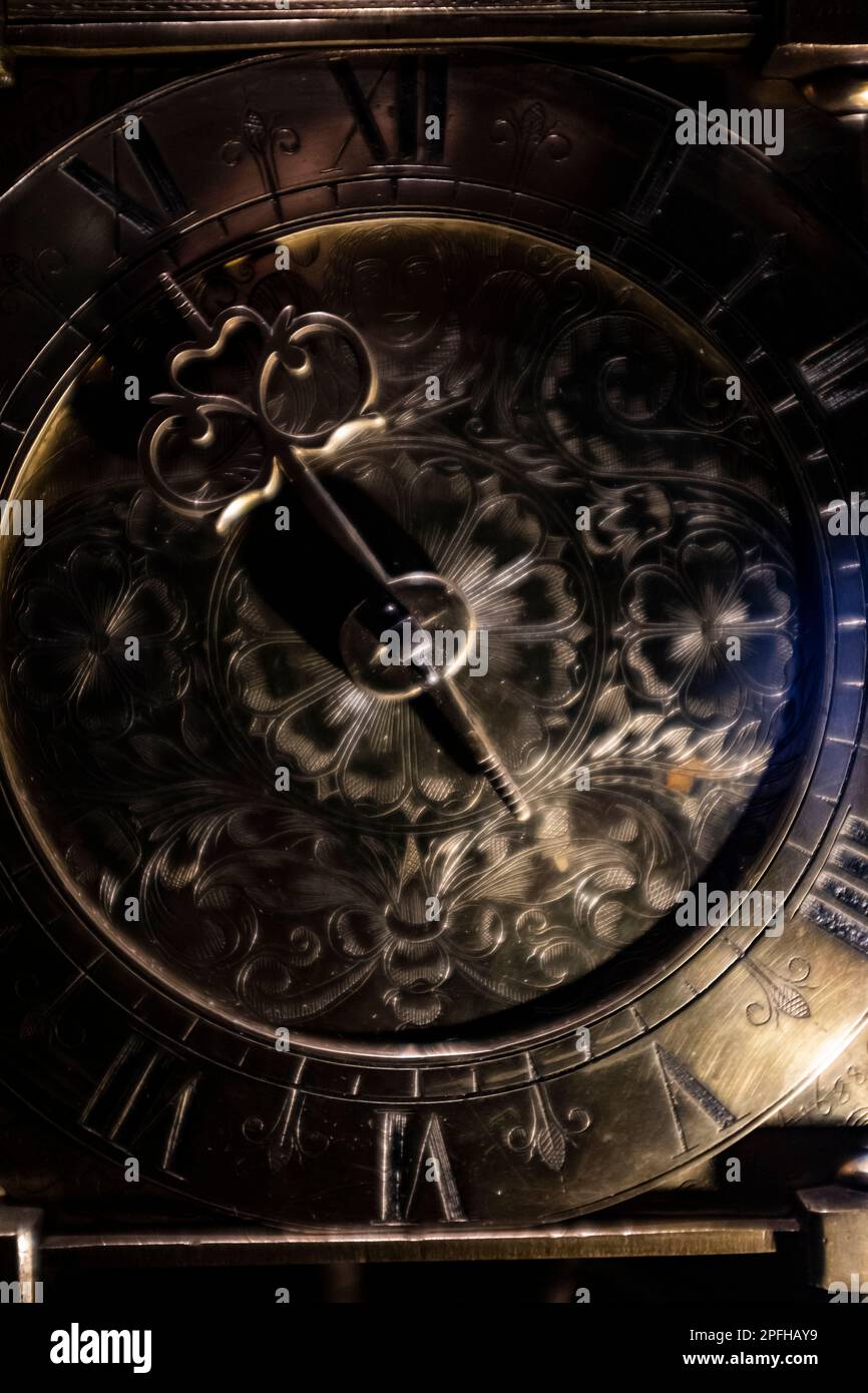 Ancient old clock watch with ancient asian and roman inscriptions close ...