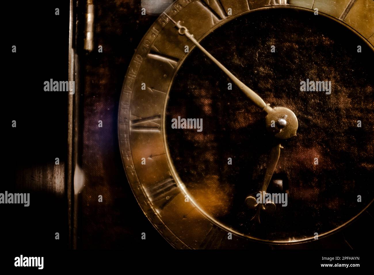 Ancient old clock watch with ancient asian and roman inscriptions close ...