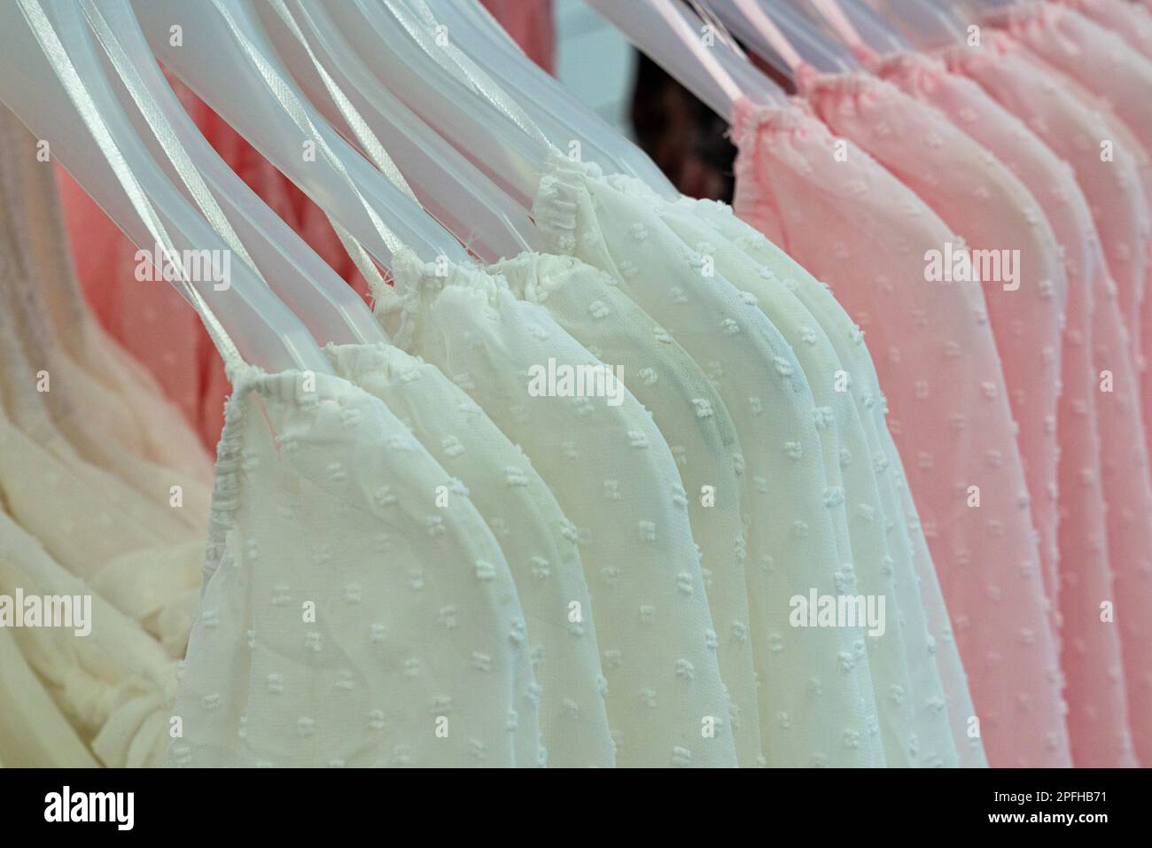 Casual wear. Modern Fashion Women Clothes Hanging On Plastic Hangers In ...