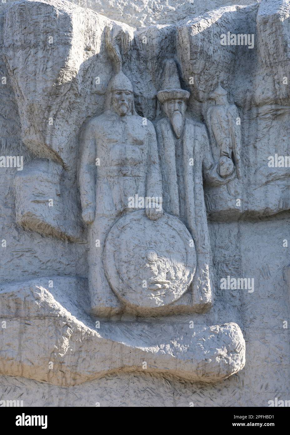 Bas-relief with national historical figures of a warrior and an elder ...