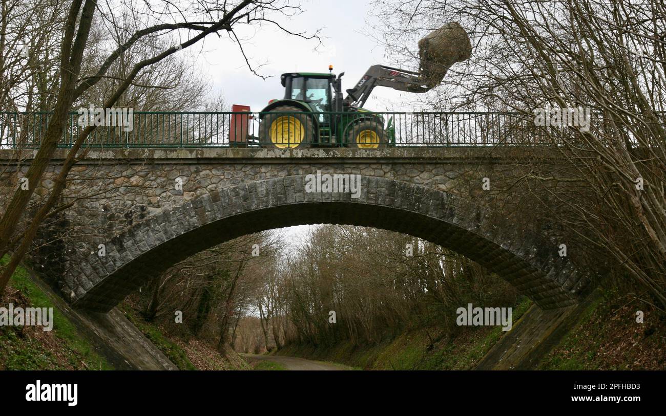 A tractor on a bridge Stock Photo - Alamy