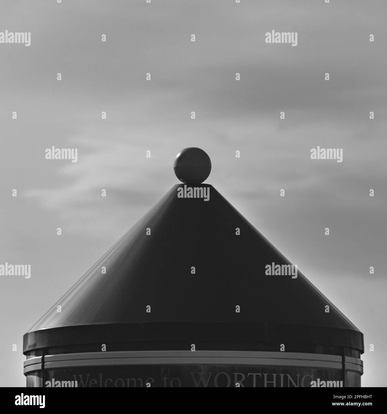 top of sign post on Worthing Seafront, featuring a sphere on top of a ...