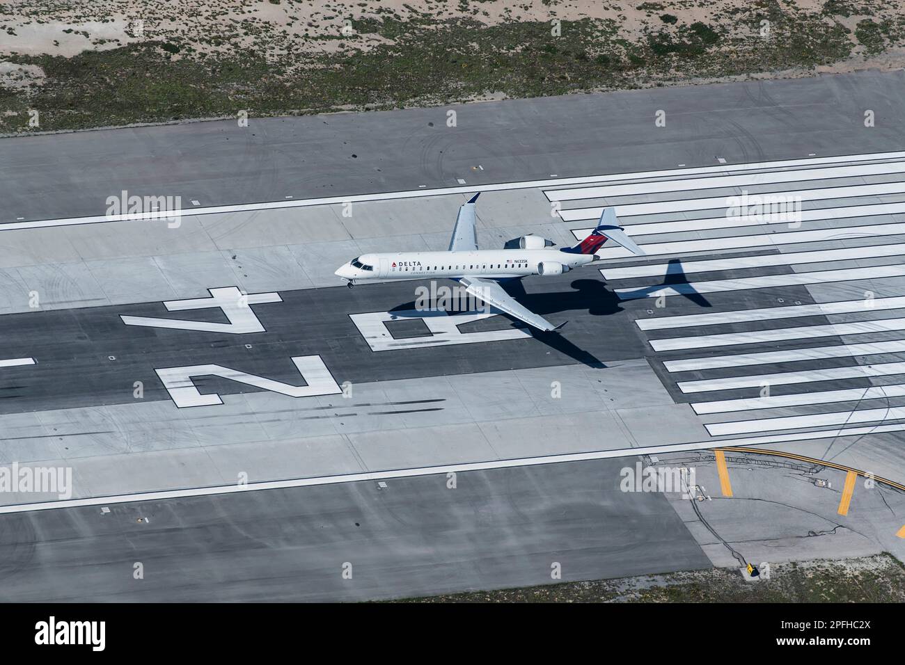 Commercial airliner landing taking off taxiing at LAX Los Angeles International Airport seen ...