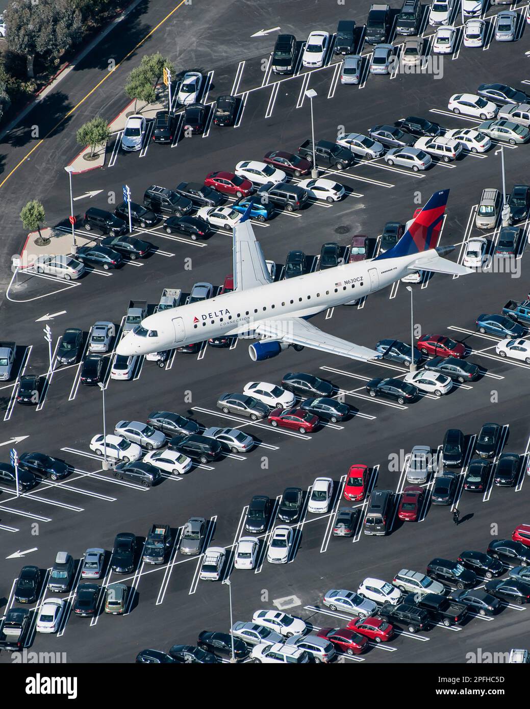 Commercial airliner landing at LAX Los Angeles International Airport seen from a helicopter ...