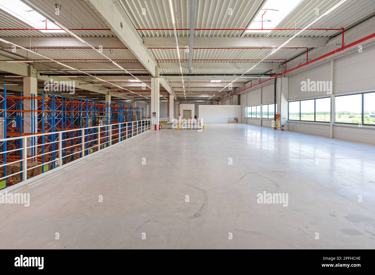 Empty Floor Space in Distribution Warehouse Interior Stock Photo - Alamy