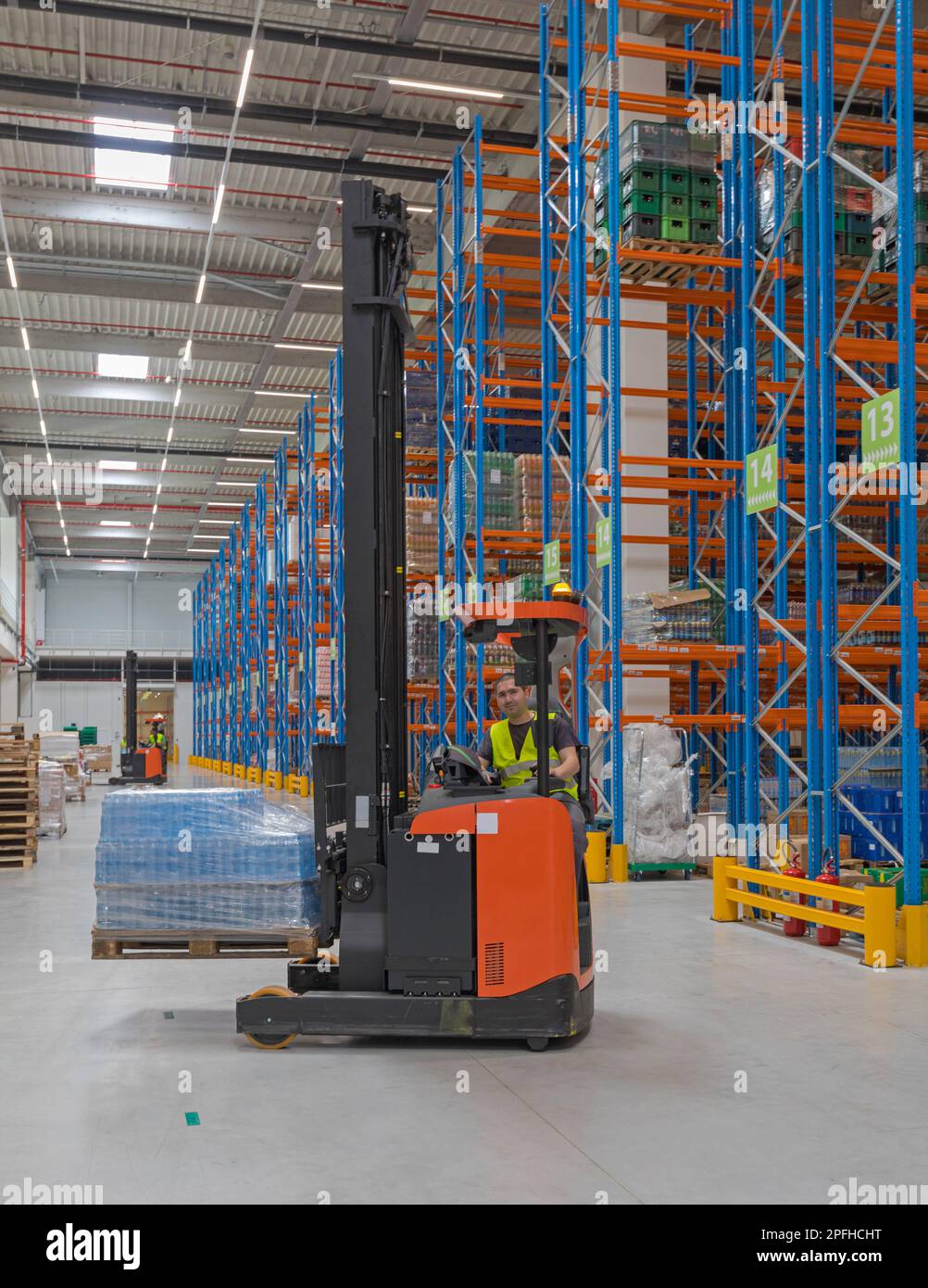 High Rack Stacker Forklift Driver in Distibution Warehouse Fulfilment ...