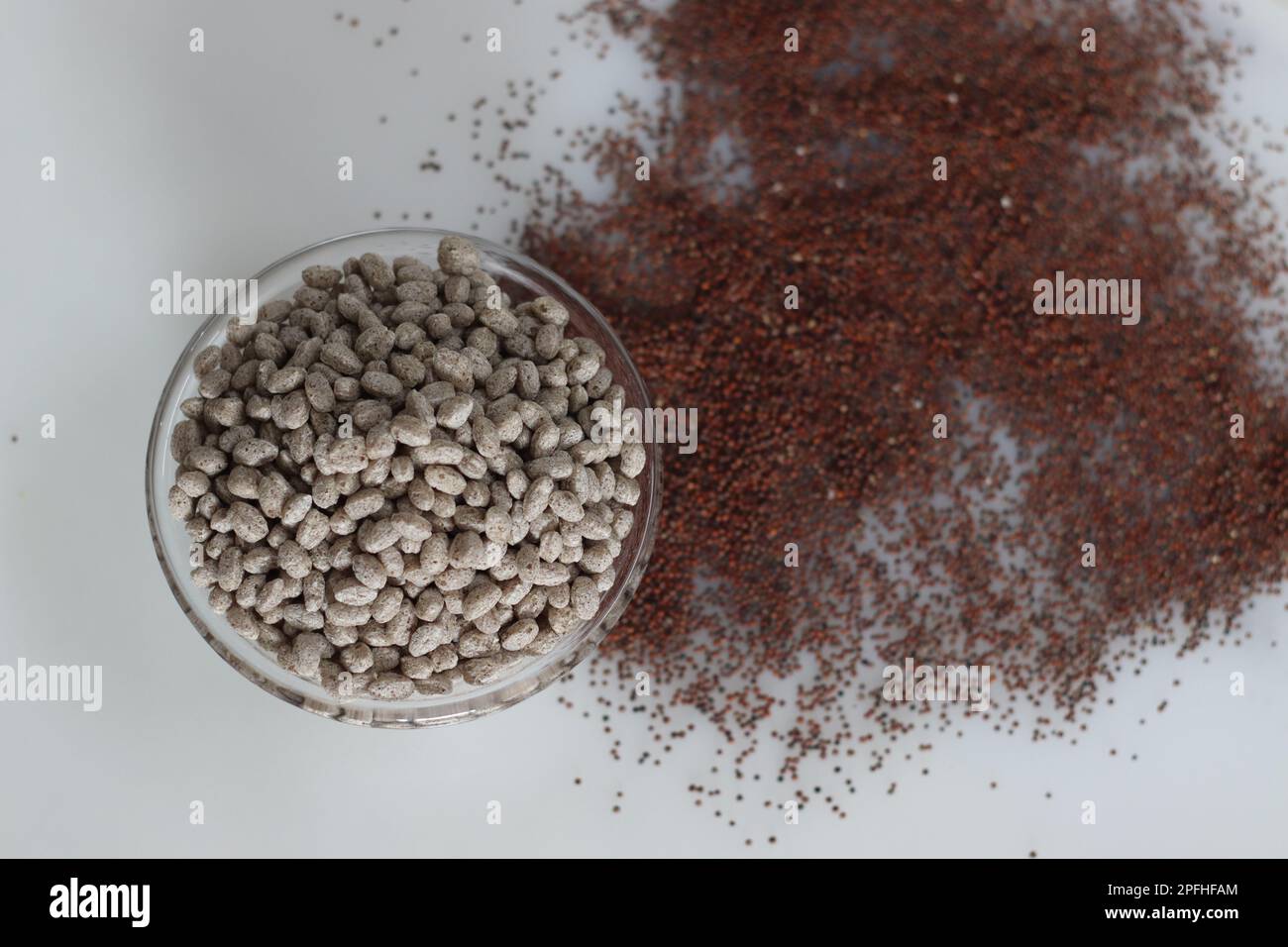 Puffed and roasted finger millet in a bowl. Finger millet is also known ...