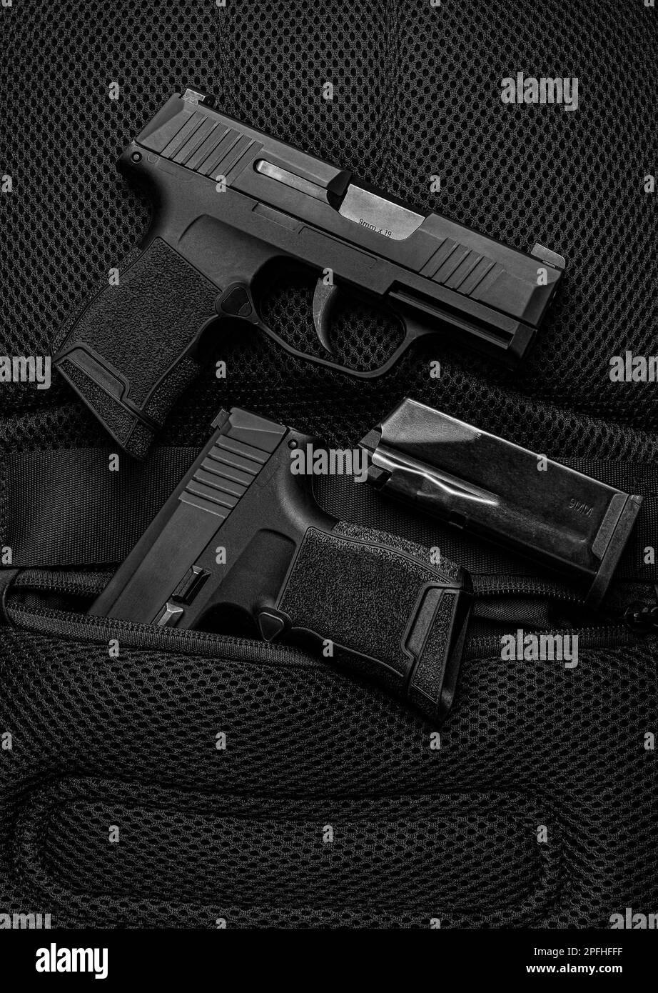 A small modern khaki semi-automatic pistols. A short-barreled weapon ...