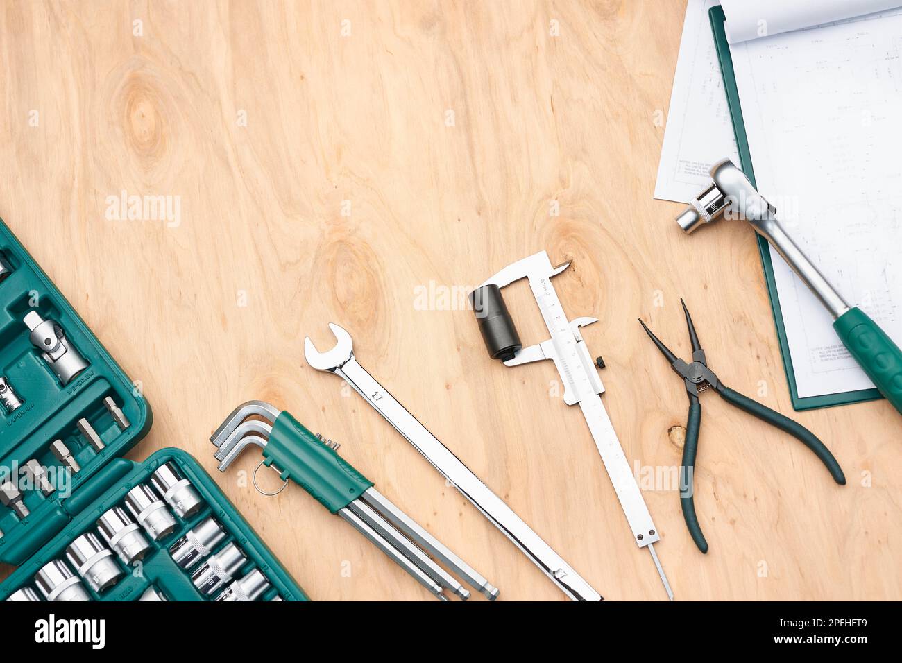 Workshop table with many tools. Wrench, spanner, calliper and ratchet ...