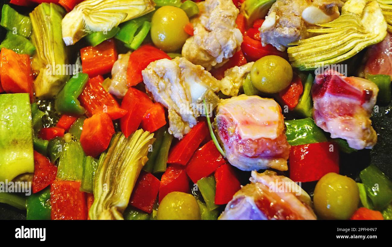 stir-fry for stew or paella over kitchen fire Stock Photo - Alamy