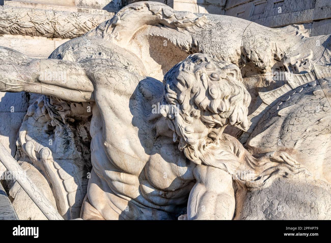 Stone decoration carving in the lower part of the monument. Close-up of ...