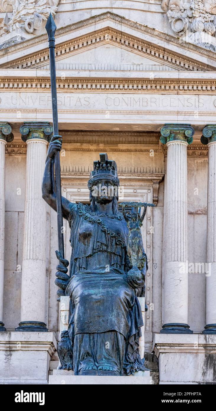 Female likeness metal statue. A woman holding a long spear ...