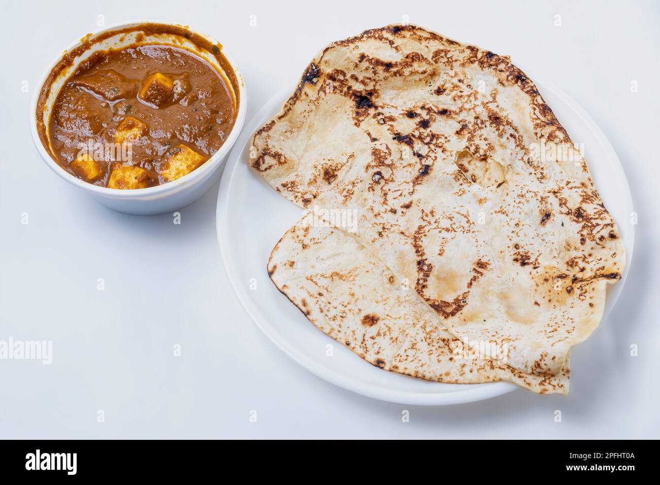 Indian traditional food, chapati or naan roti with paneer butter masala ...