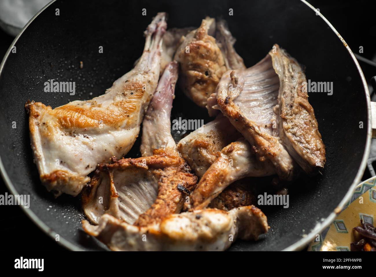 Raw rabbit with spices in a pan. Cooking stewed rabbit Stock Photo - Alamy