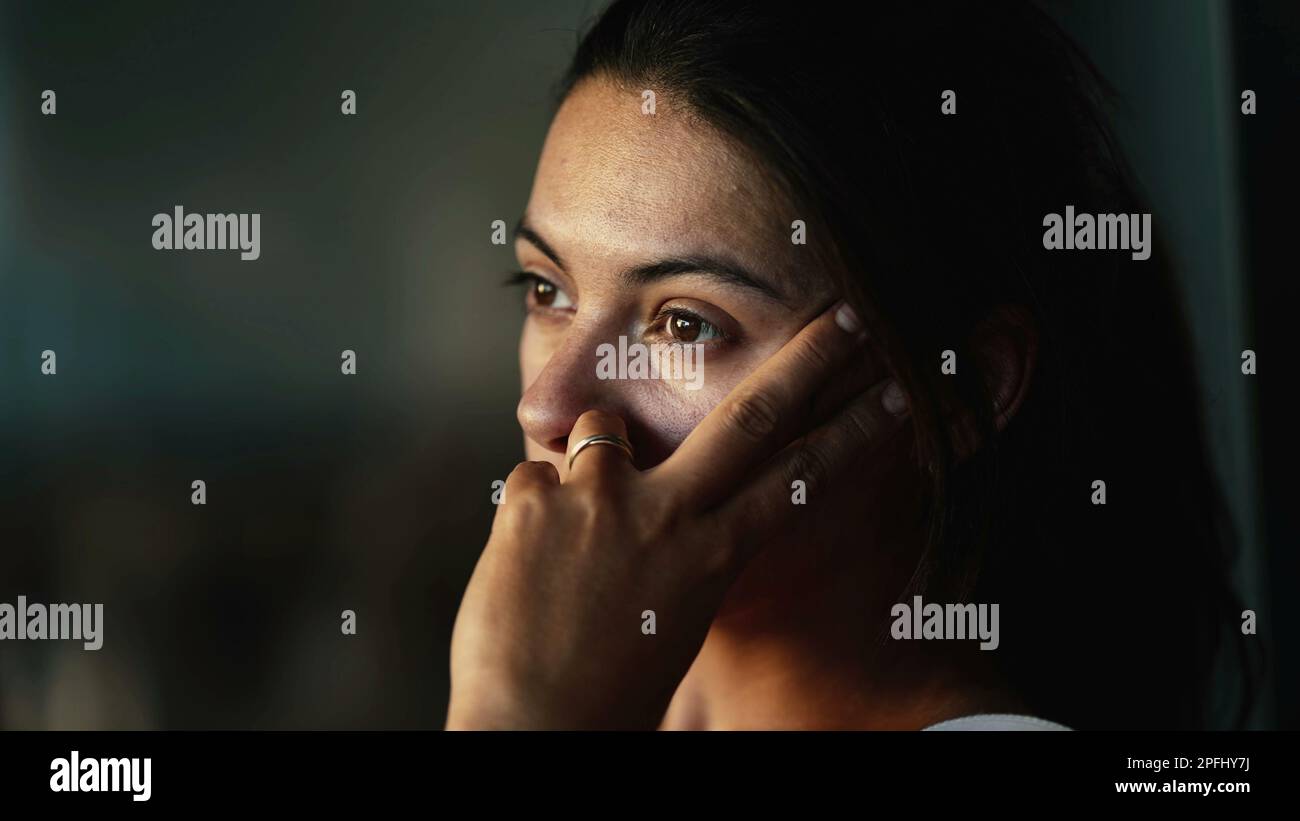 Woman closing eyes in contemplation pondering life. Thoughtful female ...