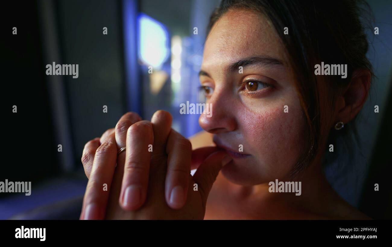Thoughtful 30s woman in contemplation. Solemn sad emotion closeup face ...