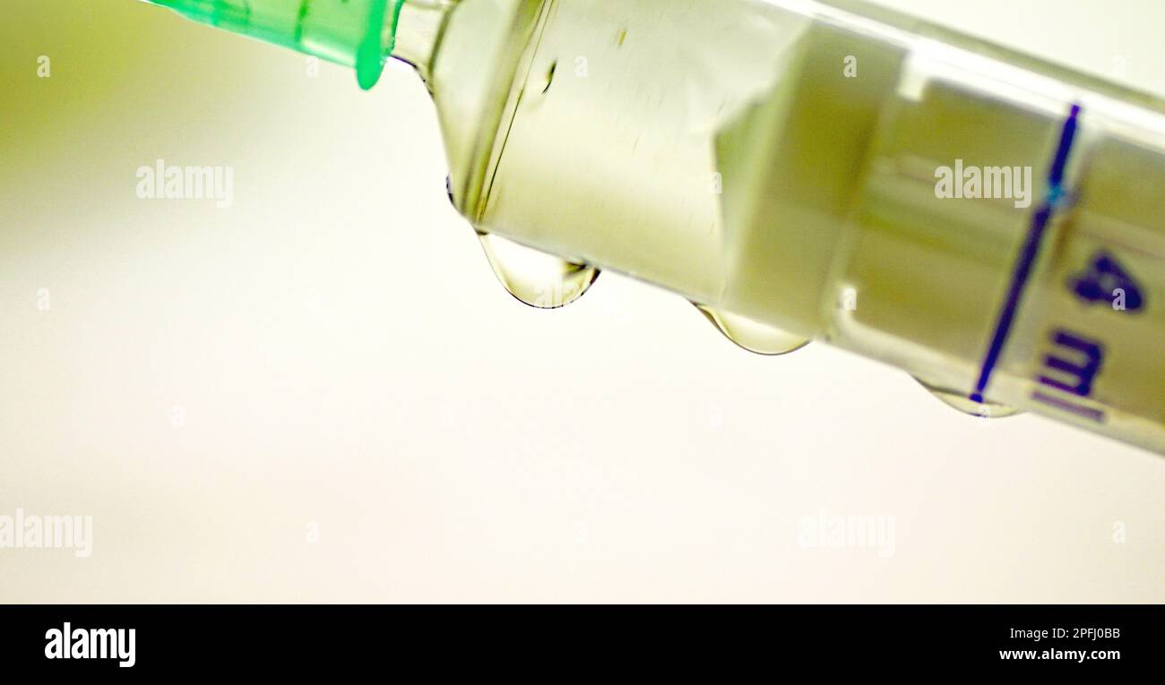Syringe and needle on white background with drops of water Stock Photo ...