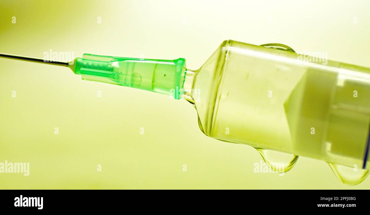 Syringe and needle on white background with drops of water Stock Photo ...