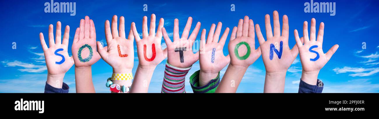 Children Hands Building Word Solutions, Blue Sky Stock Photo - Alamy
