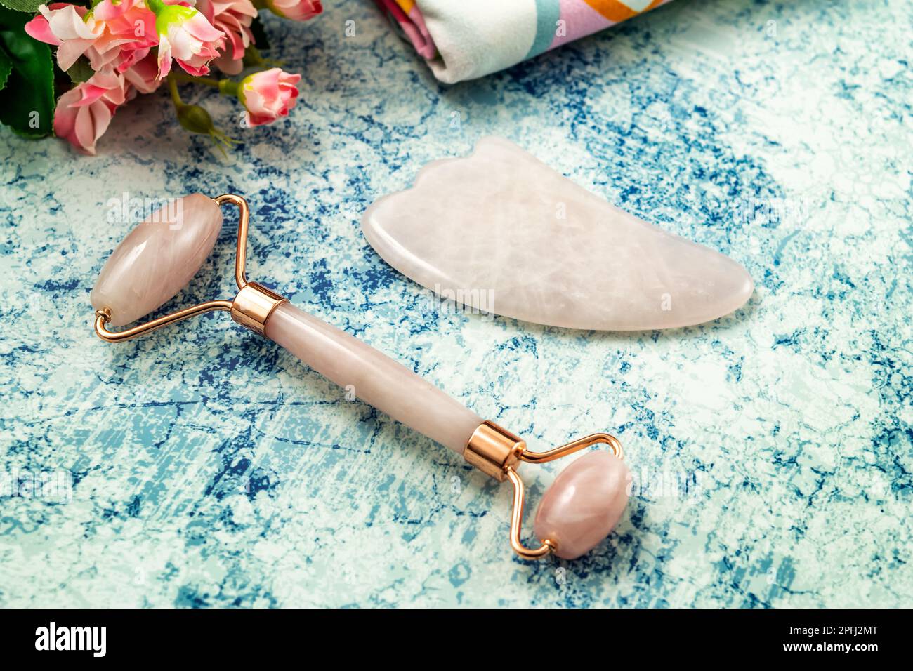 Jade Roller and Gua Sha for beauty facial massage therapy with towel ...